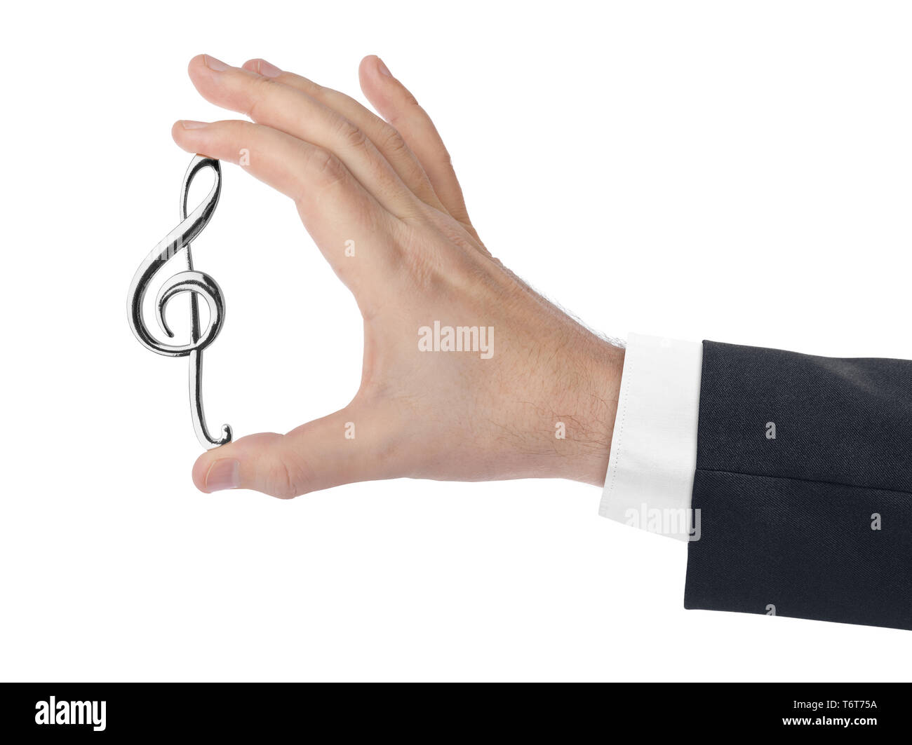 Hand holding a treble clef Stock Photo - Alamy