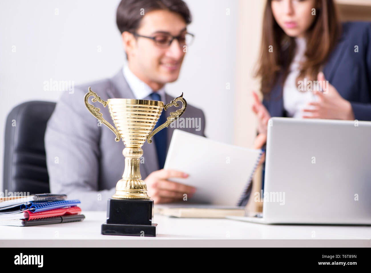 Concept of teamwork with prize Stock Photo - Alamy