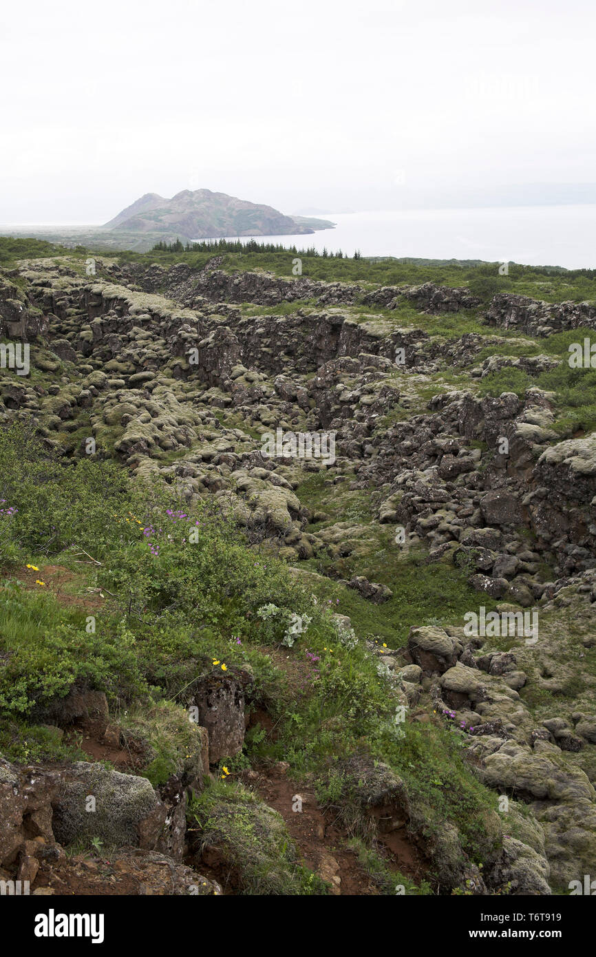Volcanic rift valley and lake caused by tectonic plate drift near ...