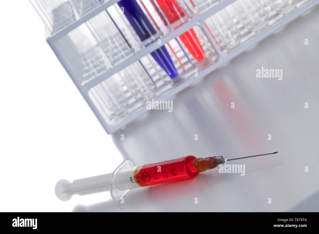 medical test tubes and syringe with blood, shallow dof Stock Photo - Alamy