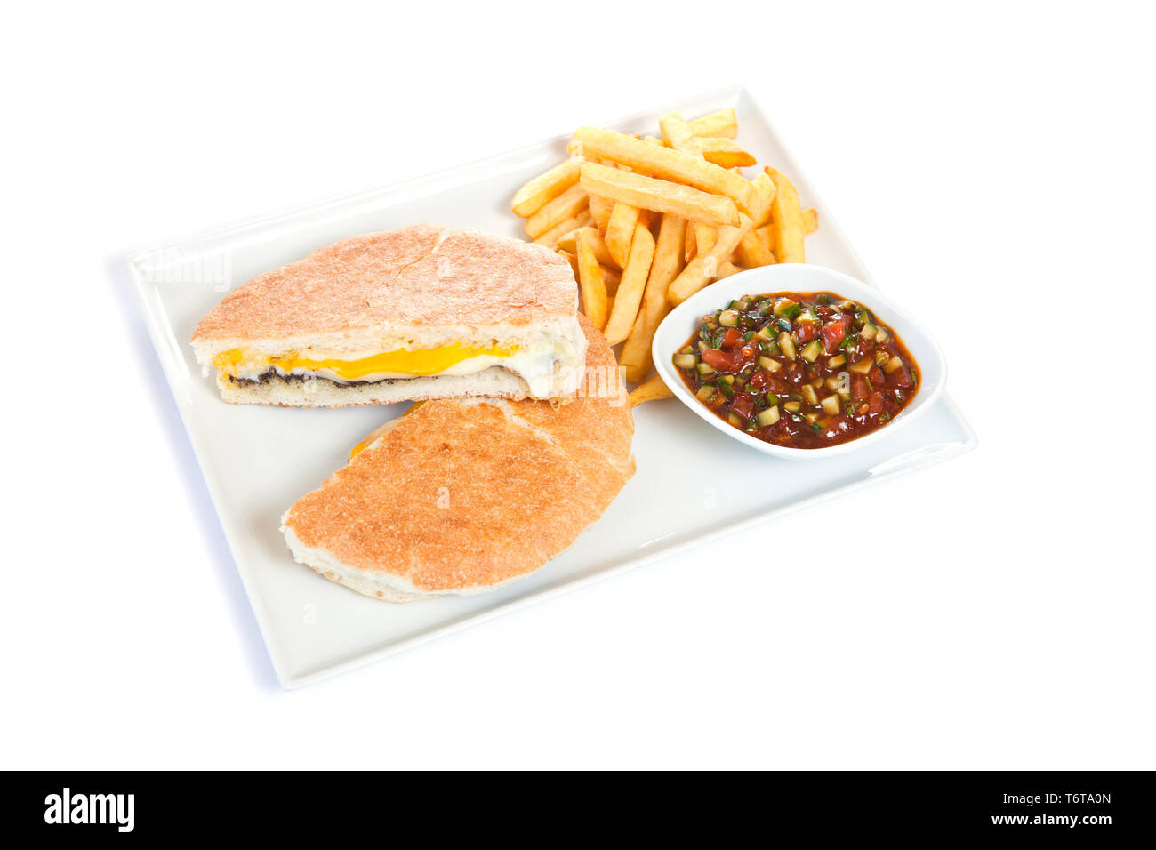 Cheese fillet with french fries and sauce Stock Photo - Alamy