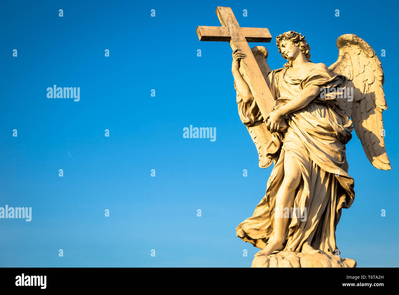 Catholic angel with cross Stock Photo - Alamy