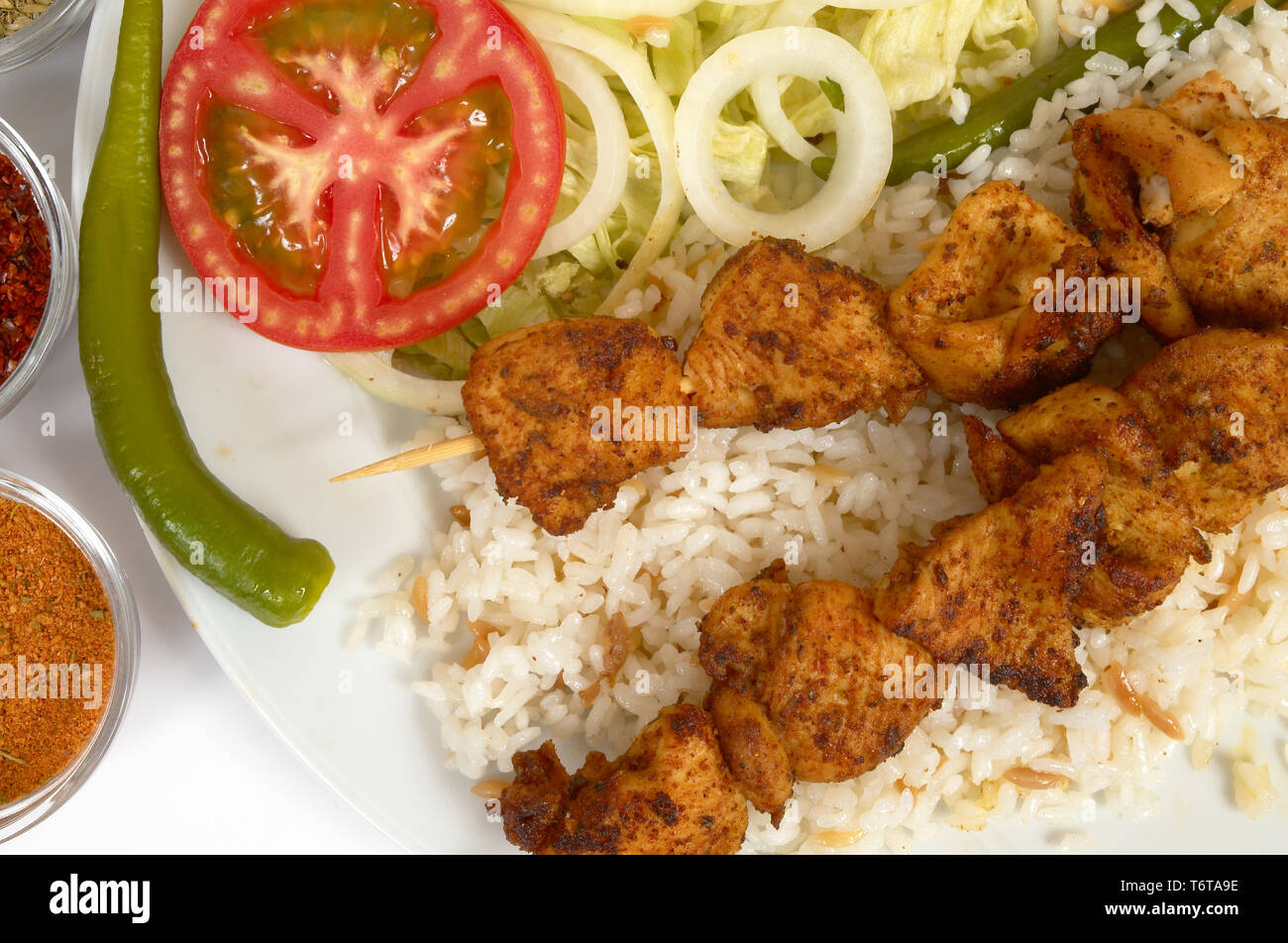 Chicken fillet ready to serve with rice and salads Stock Photo - Alamy