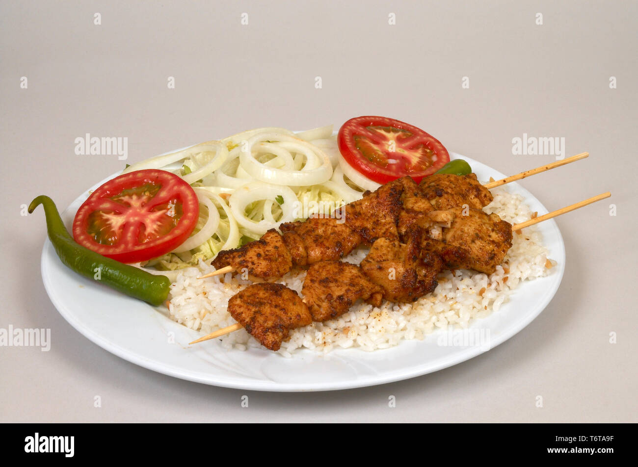 Chicken fillet ready to serve with rice and salads Stock Photo - Alamy