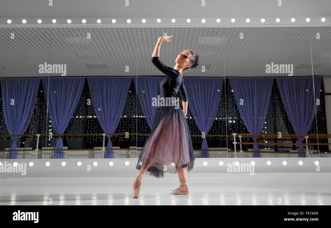 Young ballerina in training hall Stock Photo - Alamy