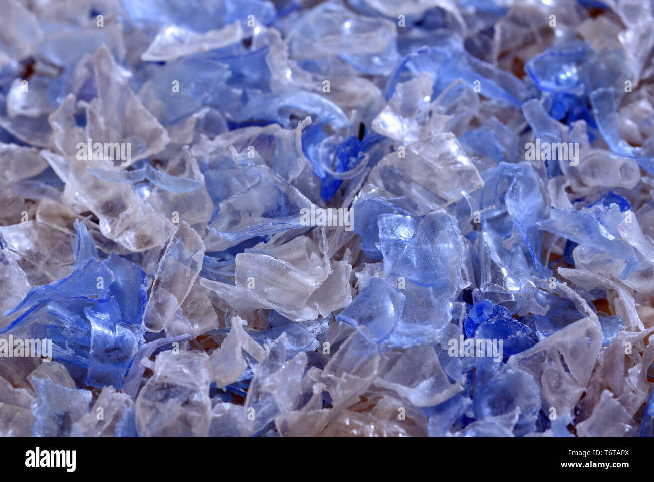 Flakes of crushed plastic bottles as raw material for further ...