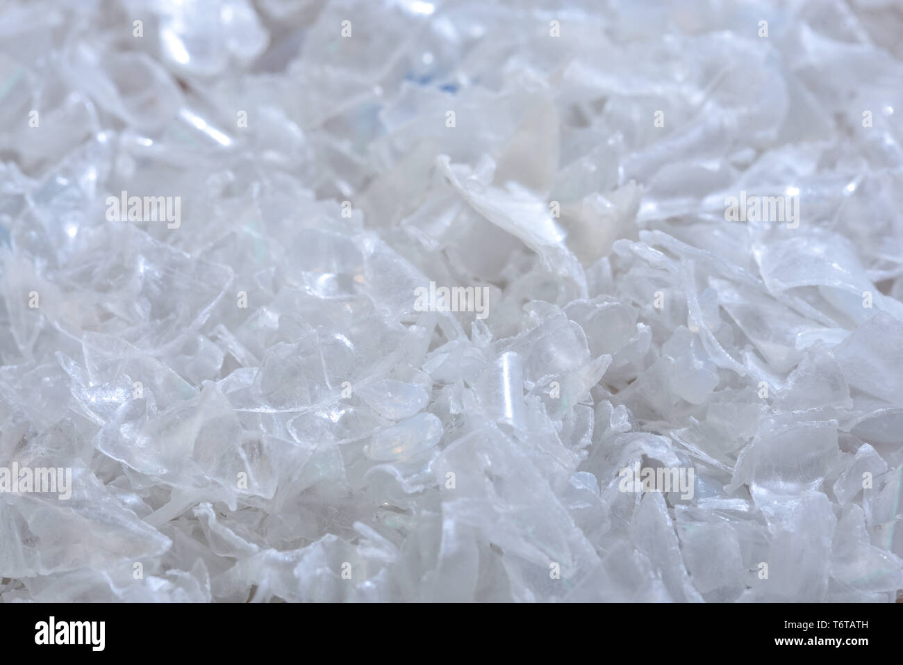 Flakes of crushed plastic bottles as raw material for further ...