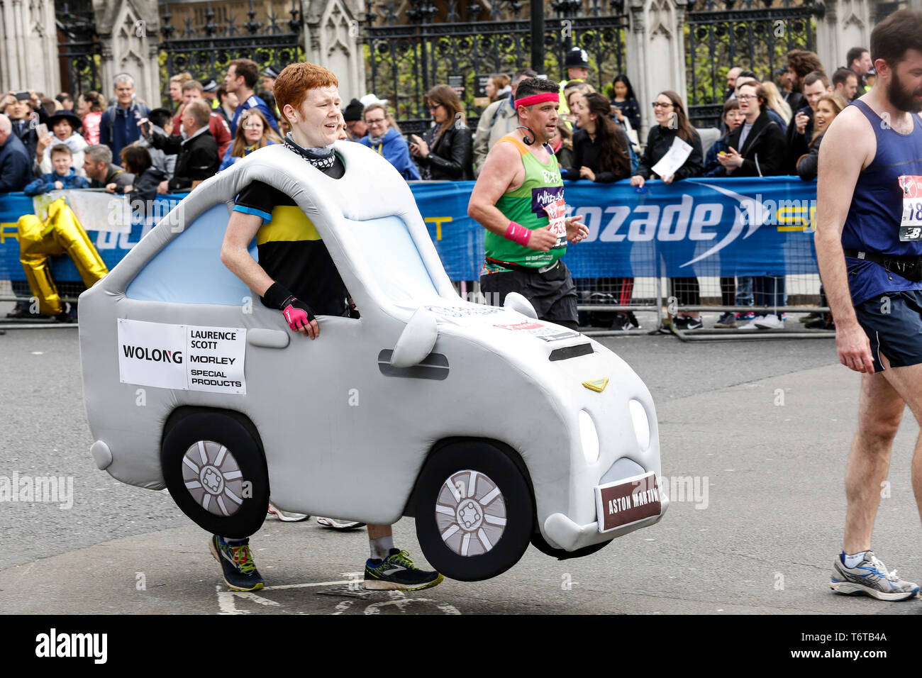 London, England – April 28, 2019: A man running as a car takes the ...