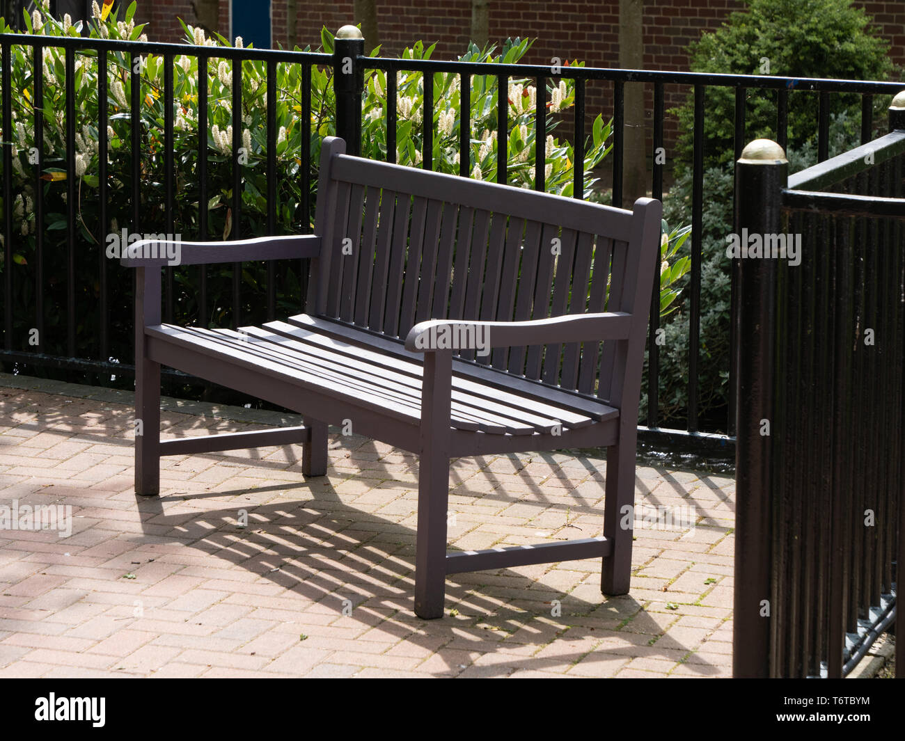 Park bench with shadow, in the sunshine Stock Photo - Alamy