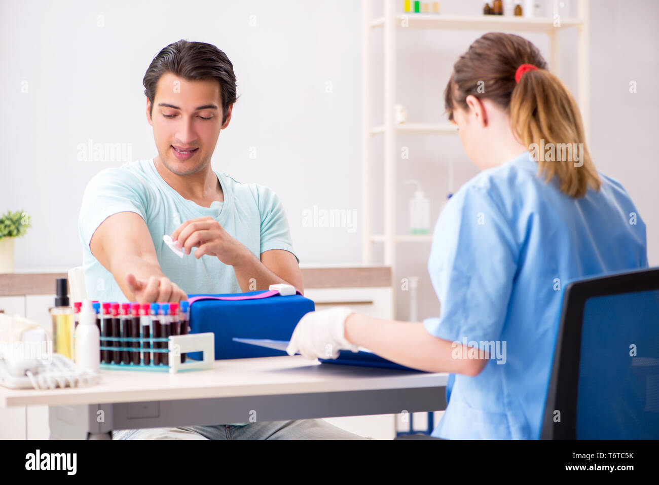 Young patient during blood test sampling procedure Stock Photo - Alamy