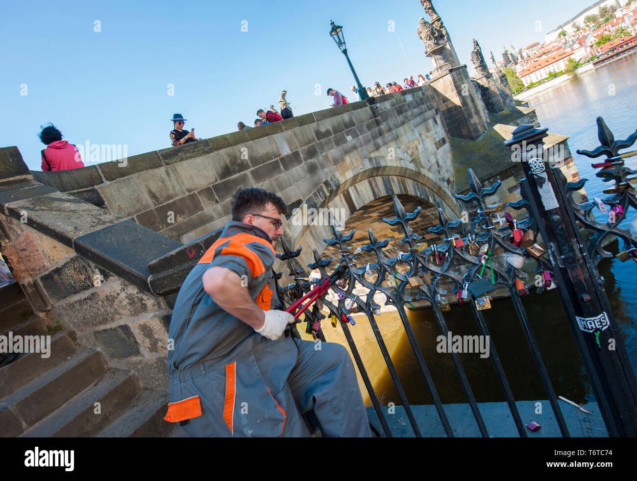 Removing love locks next to Charles Bridge in Prague, Czech Republic ...