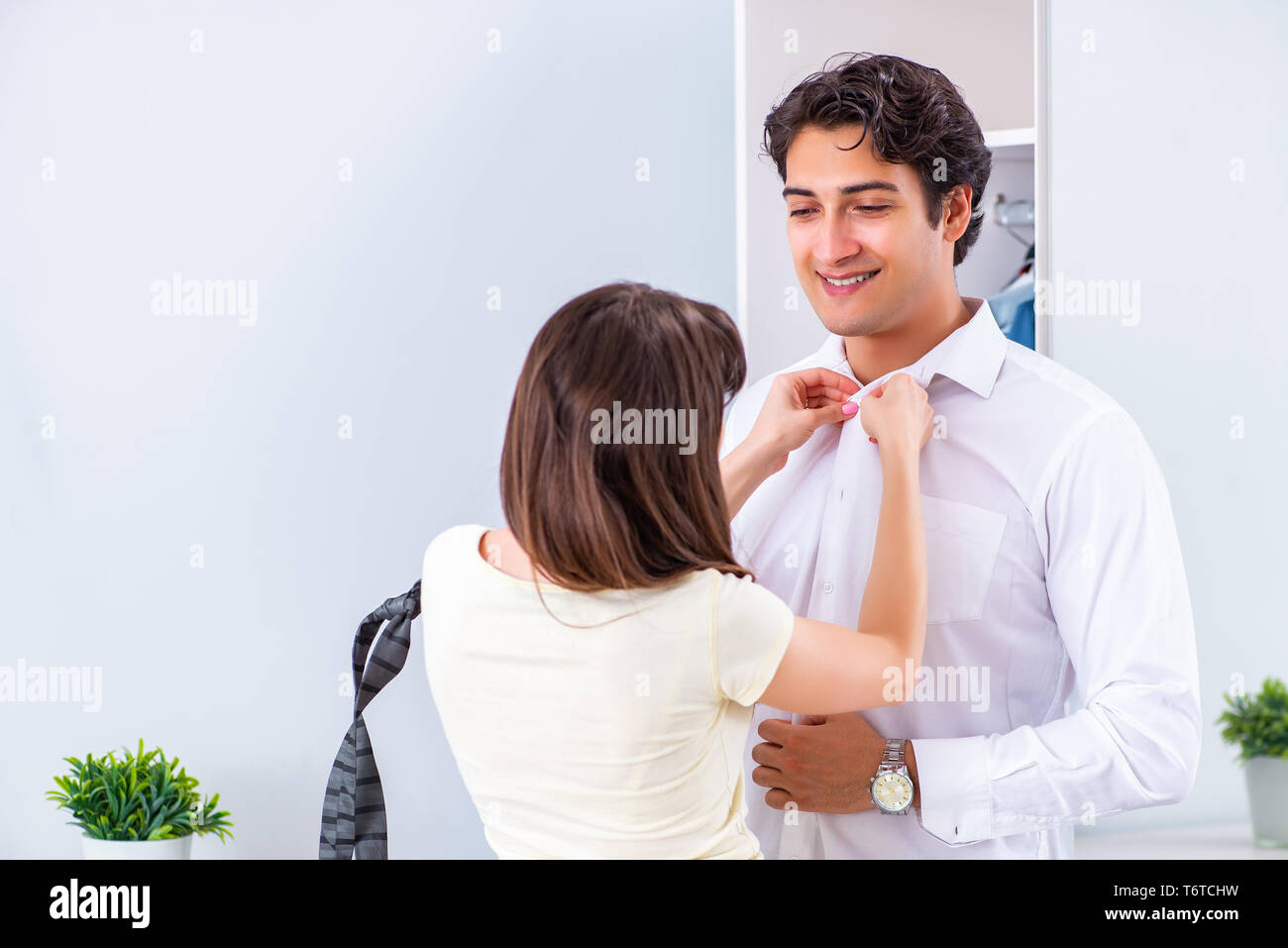 Woman sees her husband off to work Stock Photo - Alamy