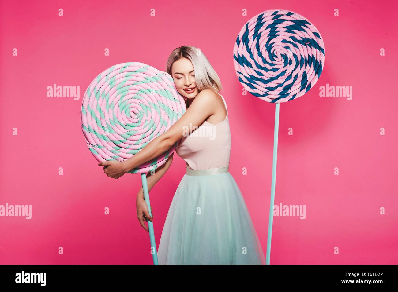 Attractive model with sweets Stock Photo - Alamy