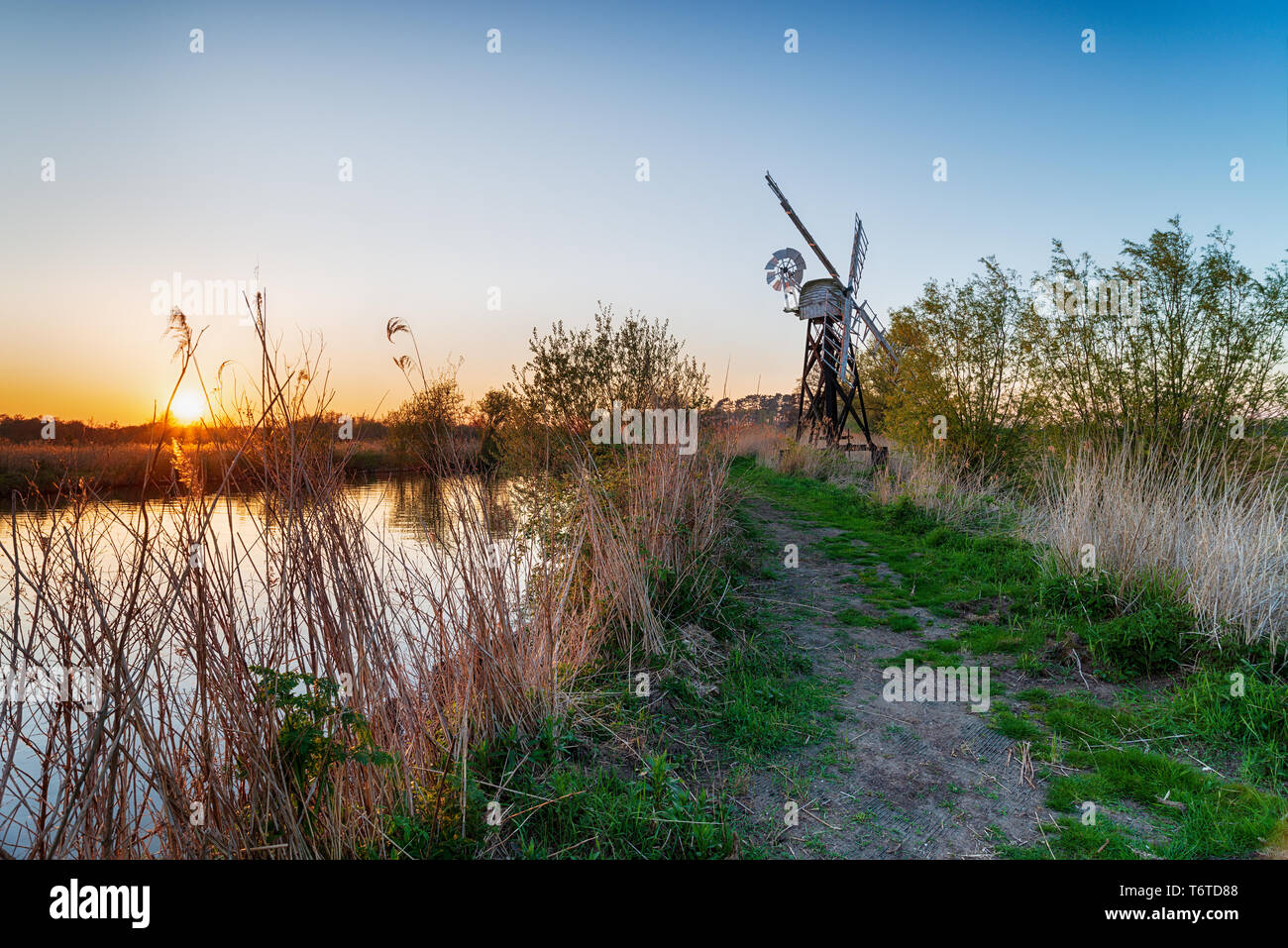 Sunset over Boardman's Drainage Mill on the banks of the river Ant at ...