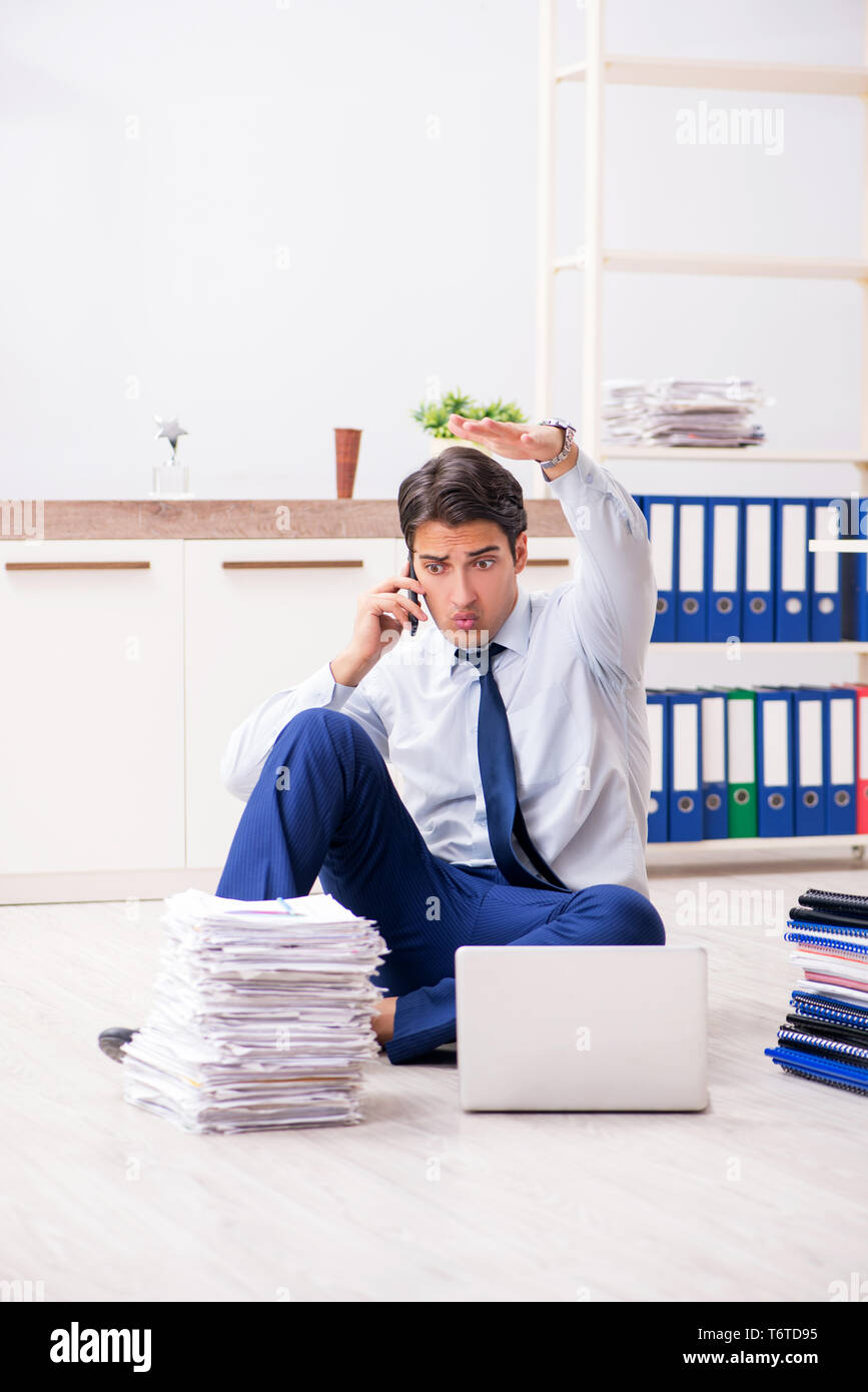 Extremely busy employee working in the office Stock Photo - Alamy