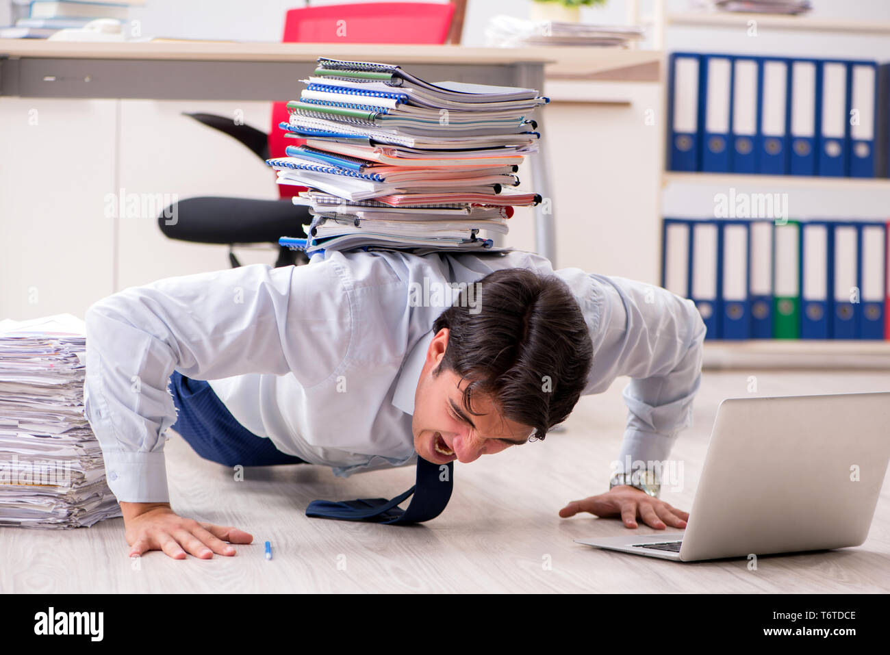 Extremely busy employee working in the office Stock Photo - Alamy