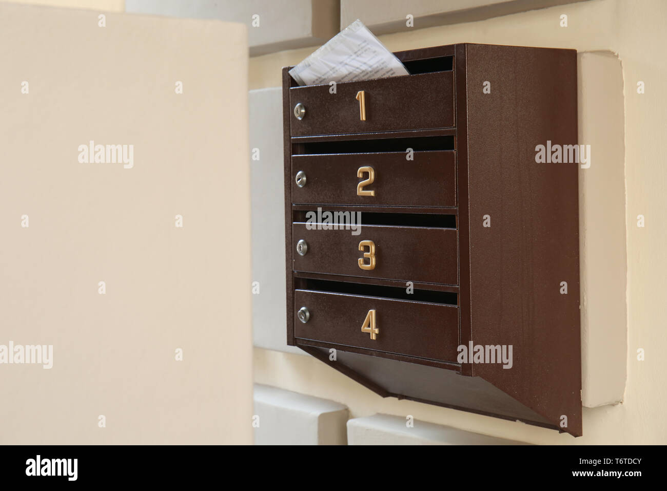 Letterbox mail station on wall of building outdoors Stock Photo - Alamy