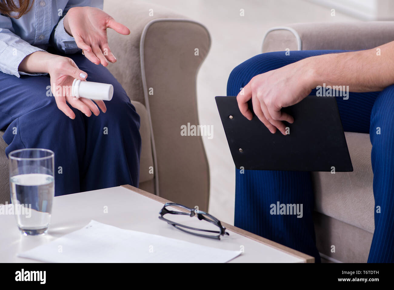 Patient discussing with psychologist personal problems Stock Photo - Alamy