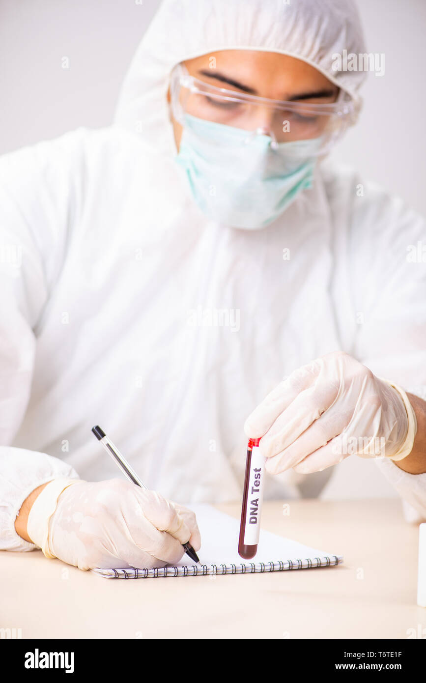 Scientist checking research results writing hi-res stock photography ...