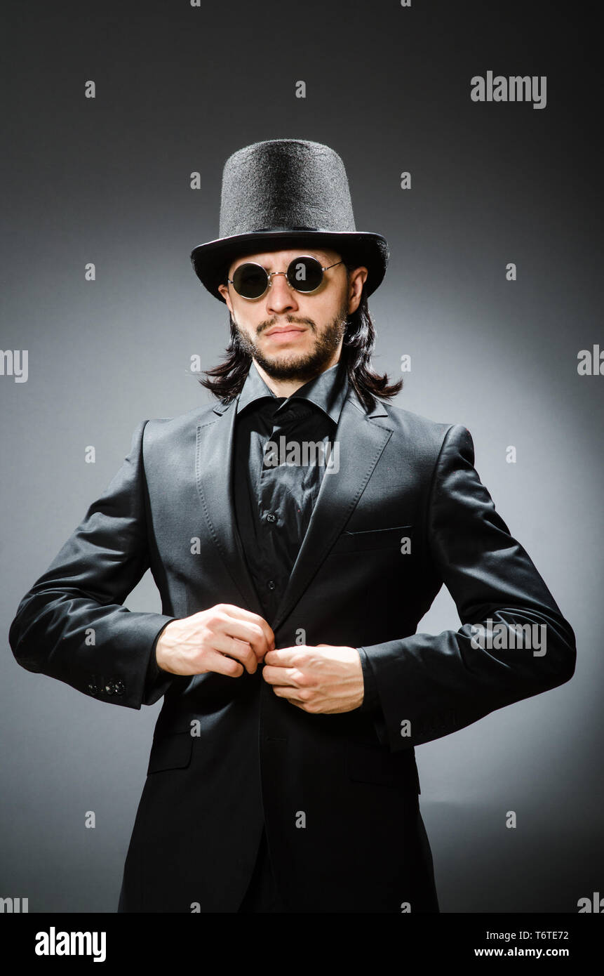 Vintage concept with man wearing black top hat Stock Photo - Alamy
