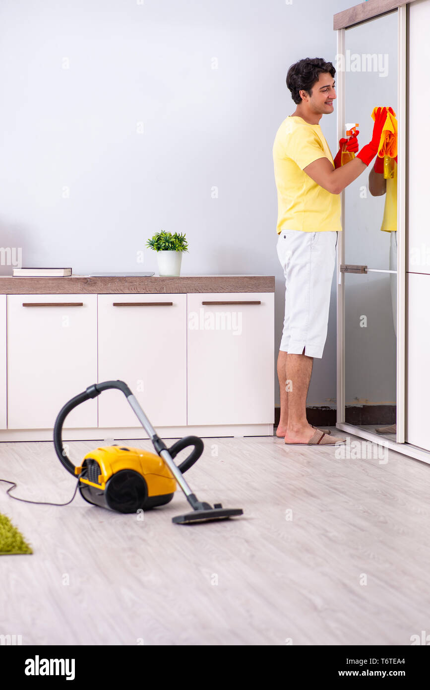 Man vacuum bed hi-res stock photography and images - Alamy