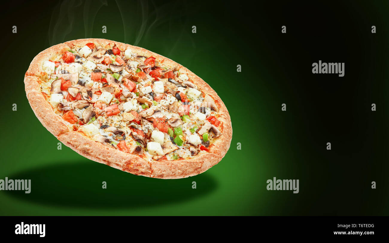 delicious fresh Italian pizza in the air just from the oven. there is ...