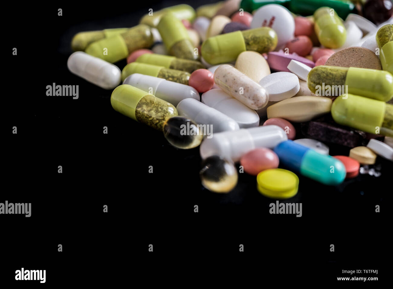Pharmaceutical tablets, capsules, therapy drugs and pills on black ...
