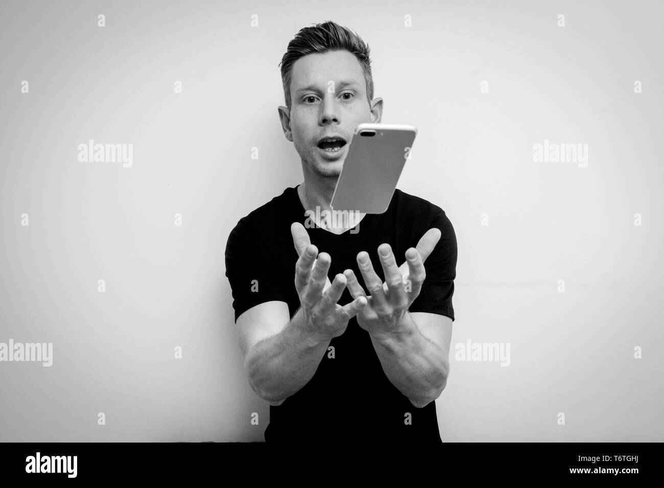 Dropping phone Black and White Stock Photos & Images - Alamy