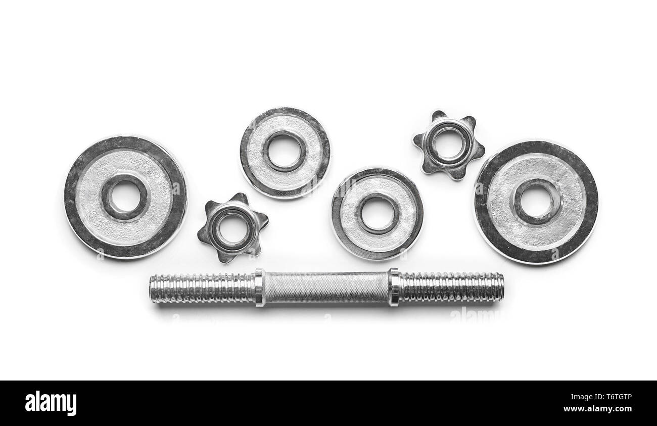 Composition with weight plates on white background, top view. Gym ...