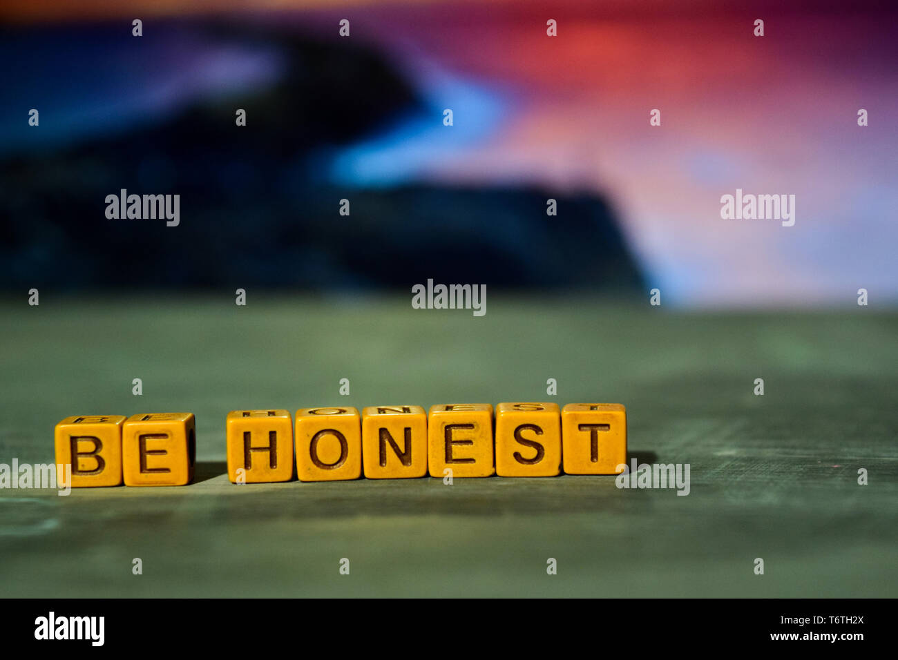Be honest on wooden blocks. Cross processed image with bokeh background ...