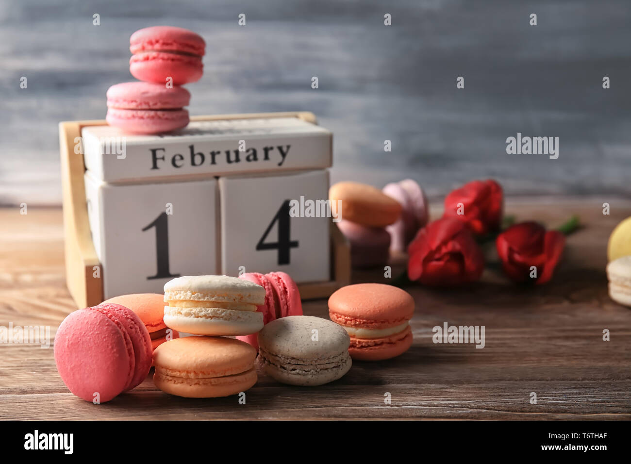 Composition with macarons and block calendar on table Stock Photo - Alamy