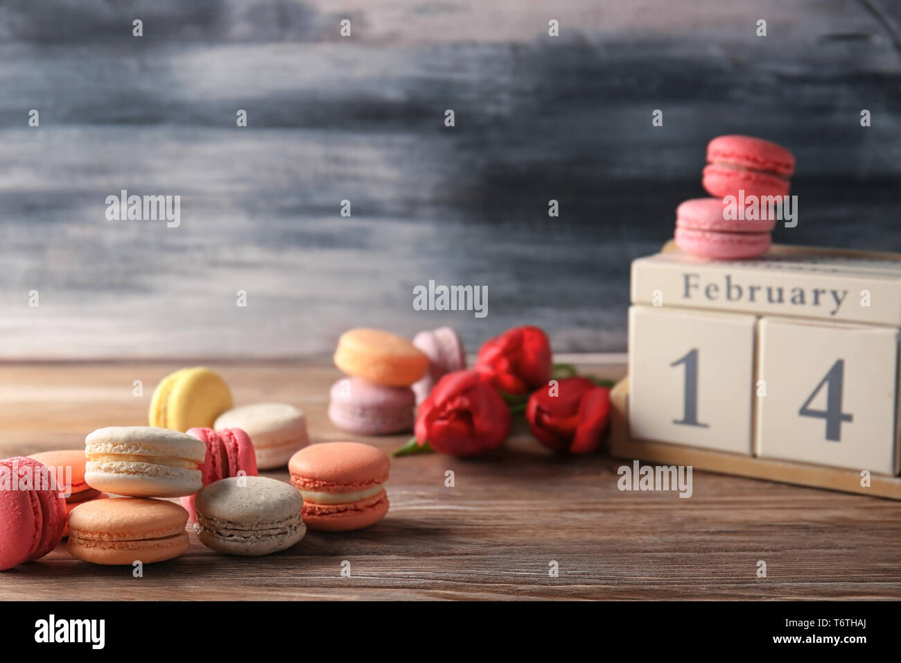 Composition with macarons and block calendar on table Stock Photo - Alamy