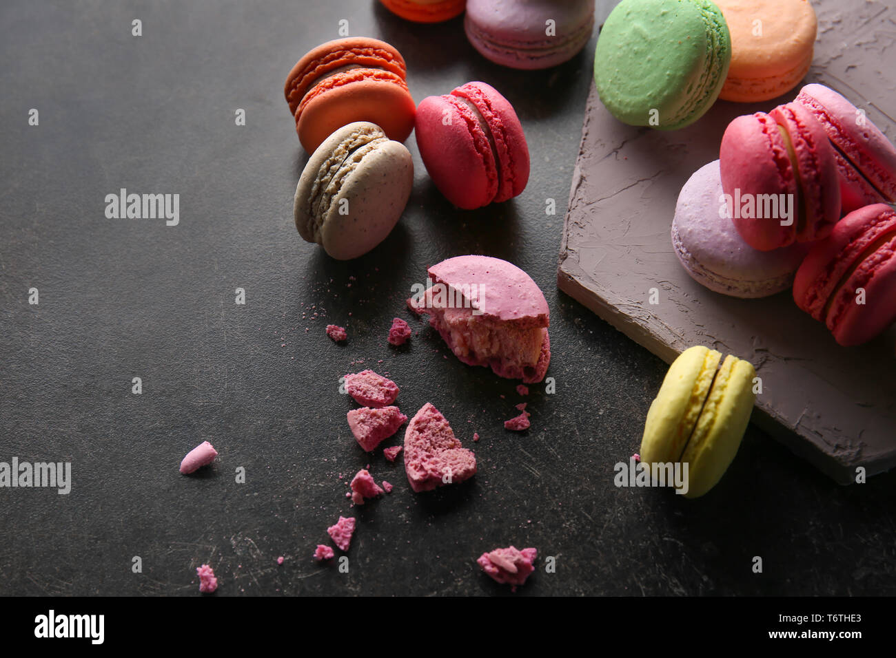 Colorful macarons on dark background Stock Photo - Alamy