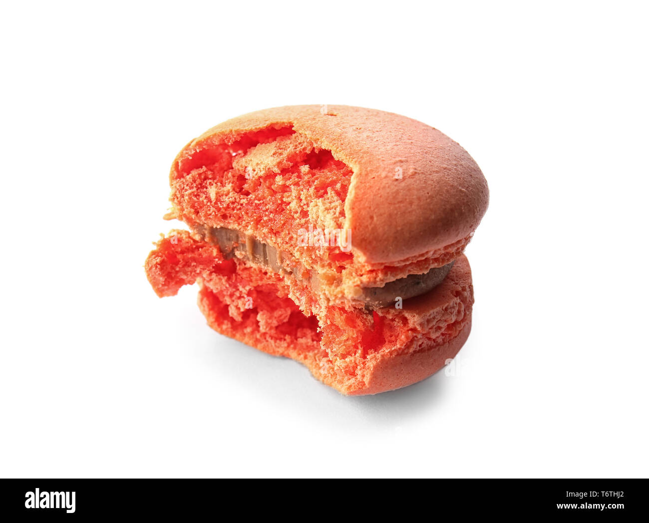 Tasty orange macaron with bite mark on white background Stock Photo - Alamy