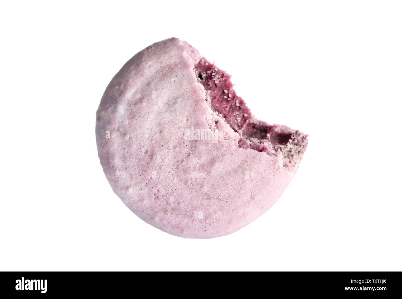 Tasty violet macaron with bite mark on white background Stock Photo - Alamy