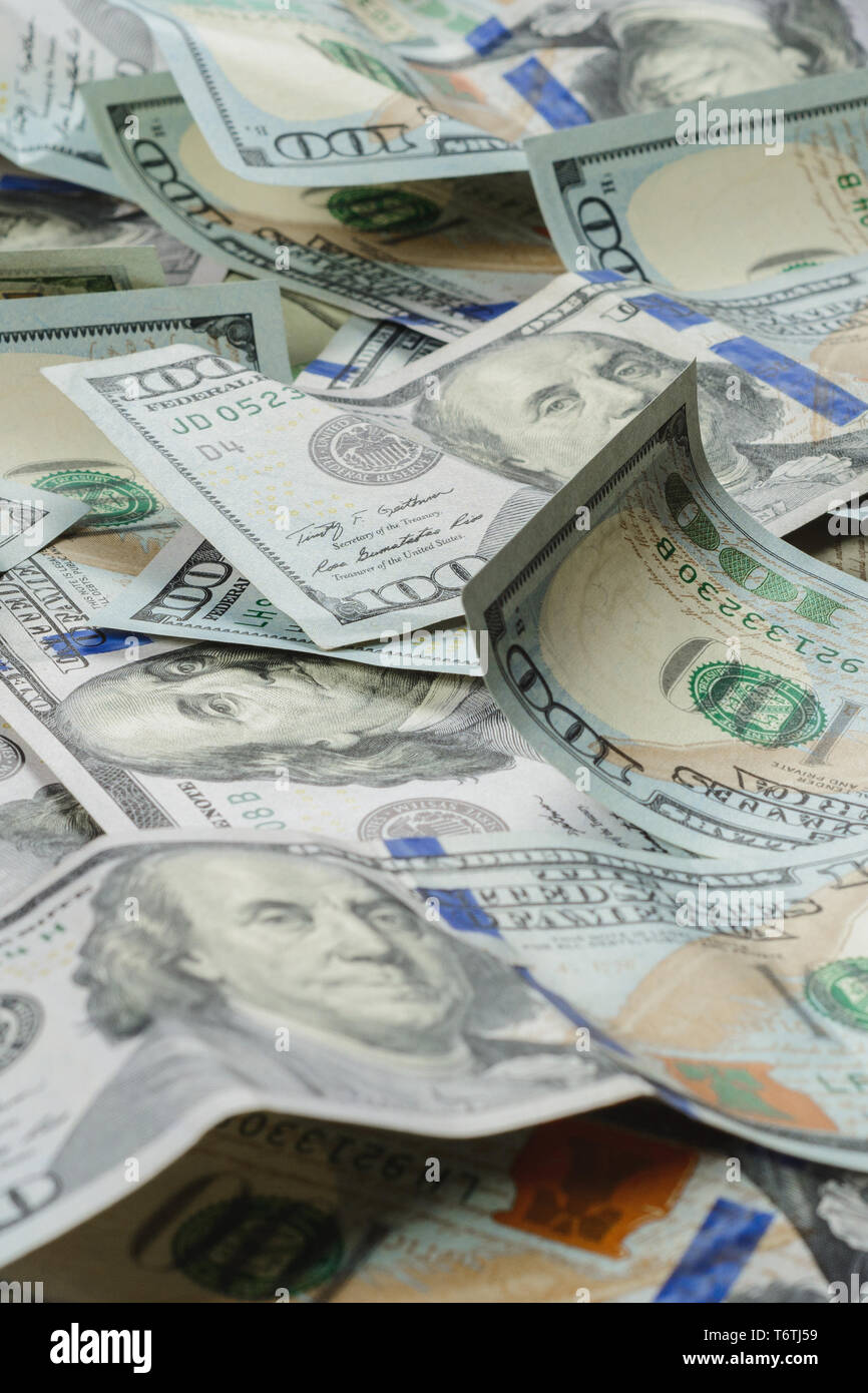Dollar notes are lined up on a table close-up, a texture of dollar bill ...