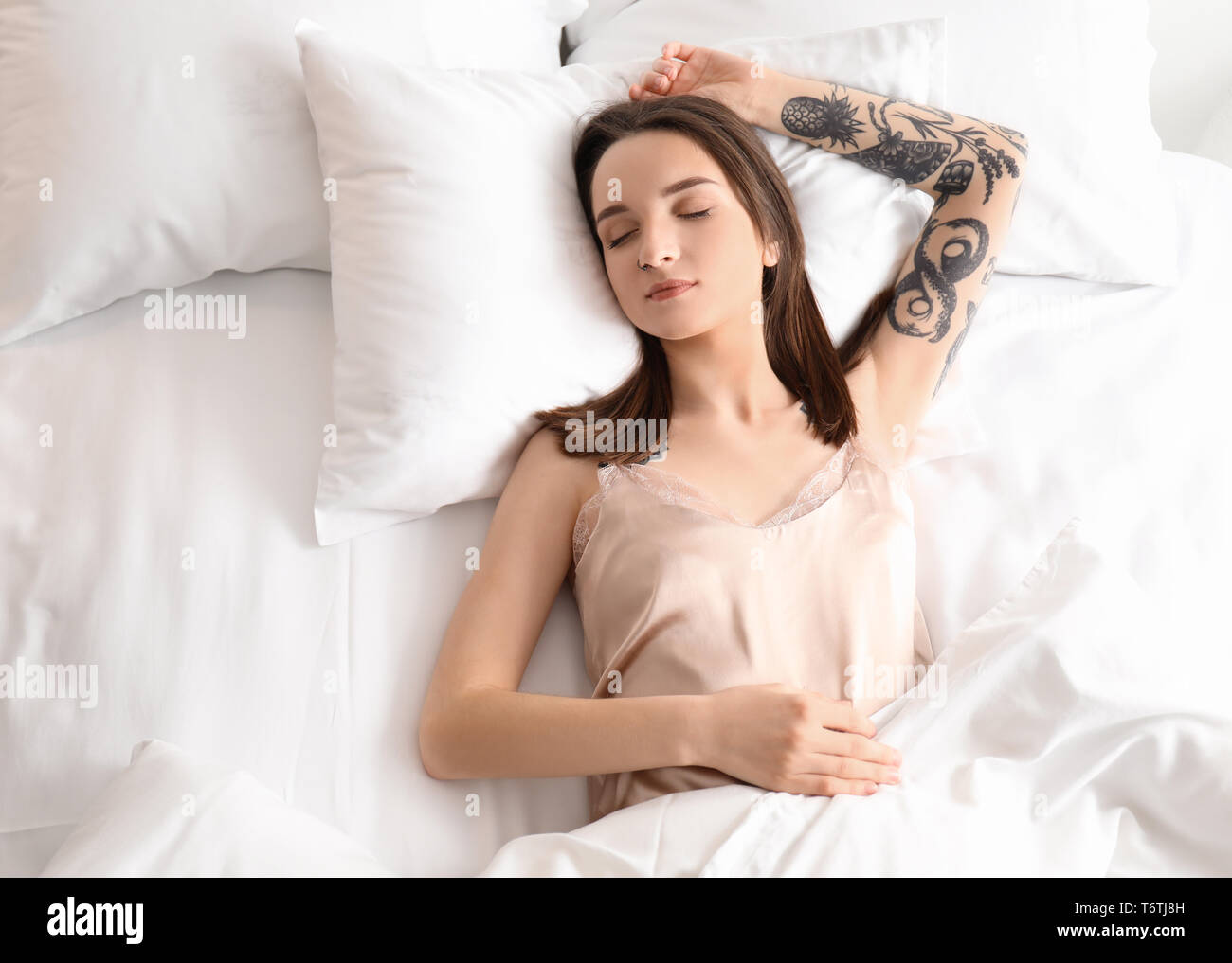 Young beautiful woman sleeping in bed at home. Early morning Stock ...