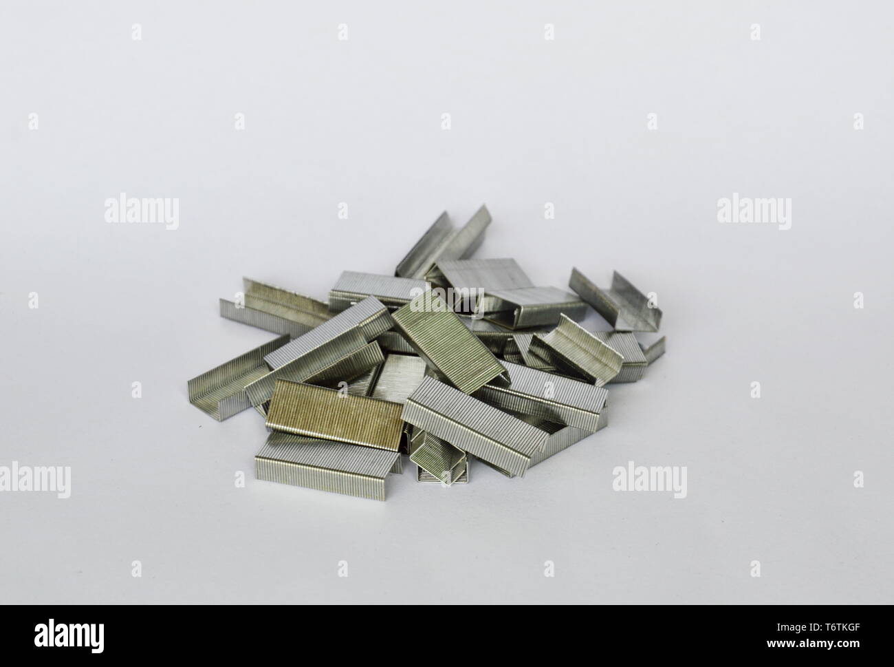 stapler wire for refill on white background Stock Photo - Alamy