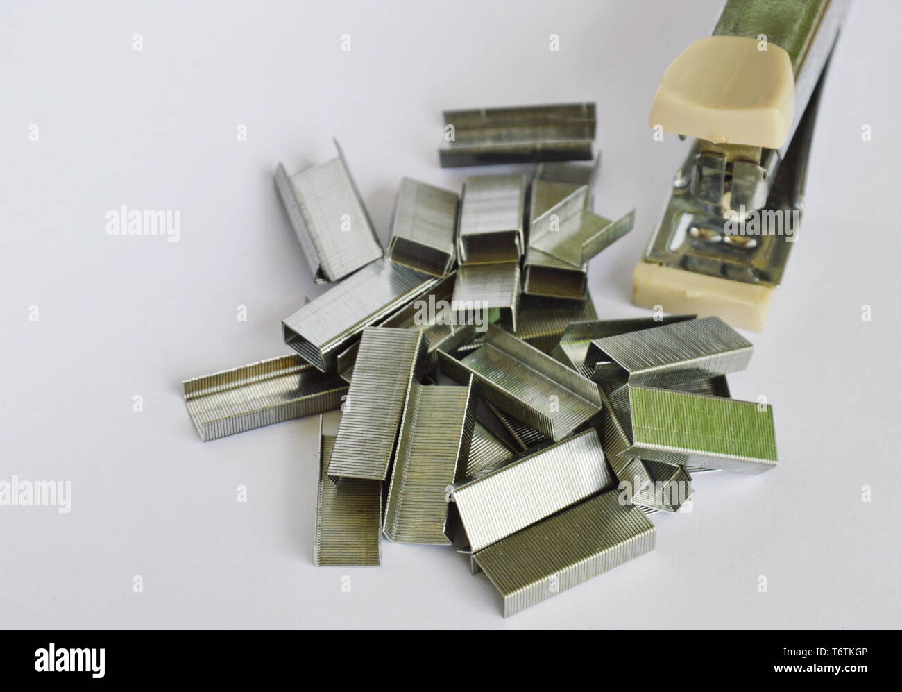 stapler and refill wire on white background Stock Photo - Alamy