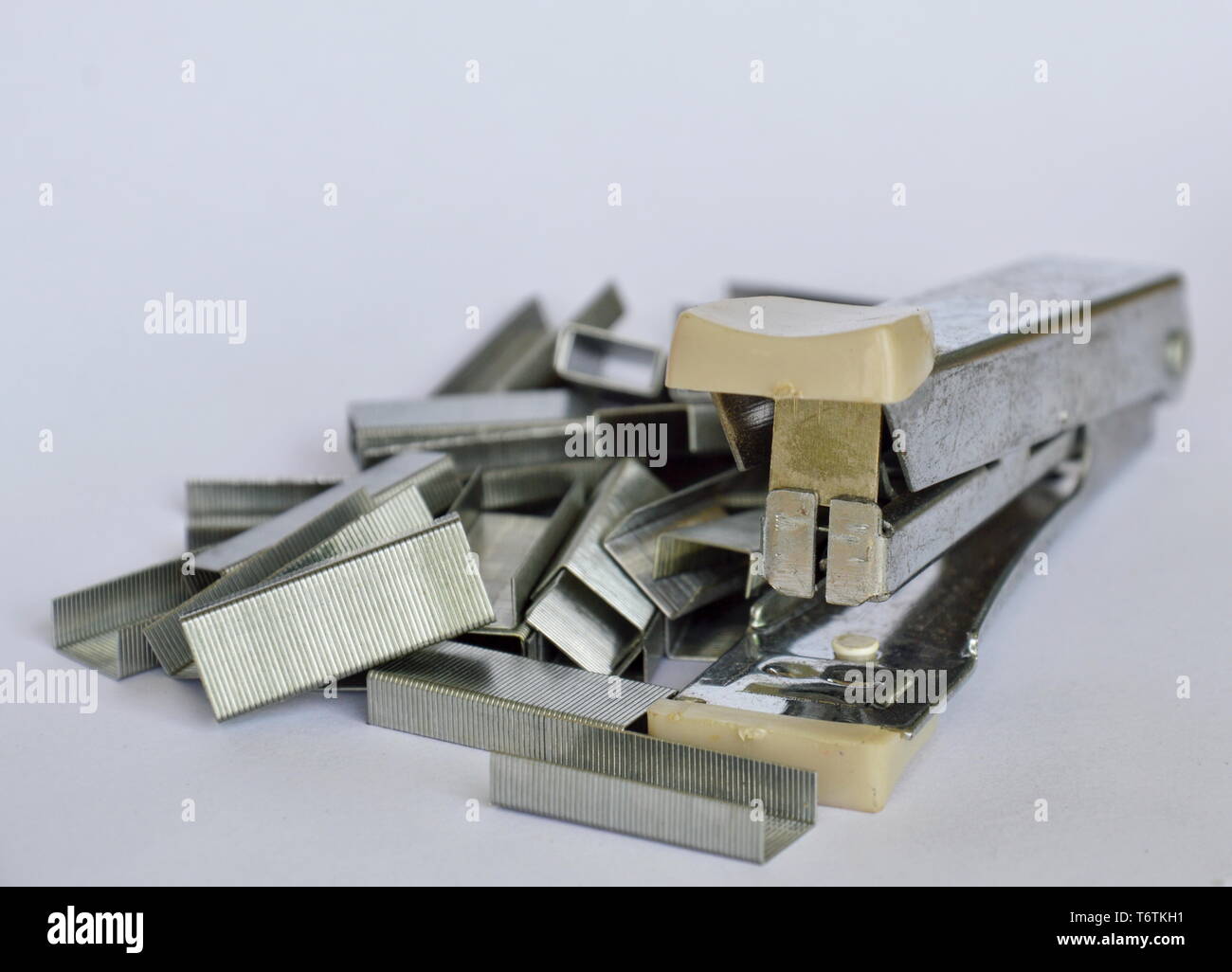 stapler and refill wire on white background Stock Photo - Alamy