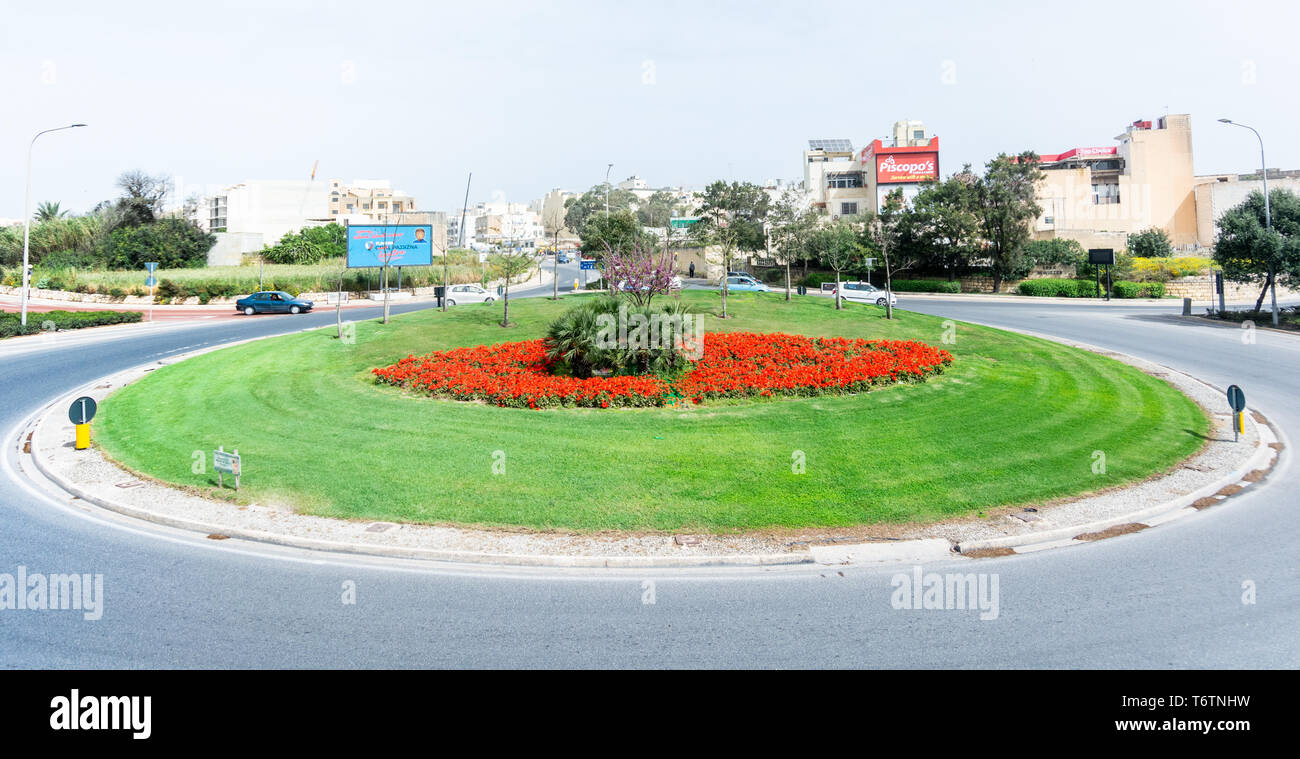 Flowers arrangement and roundabouts in Malta and Gozo Stock Photo - Alamy