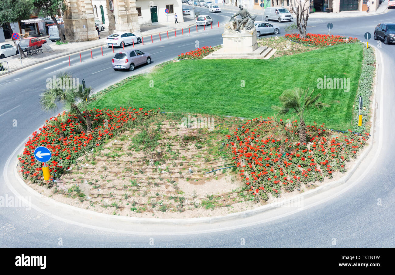 Flowers arrangement and roundabouts in Malta and Gozo Stock Photo - Alamy