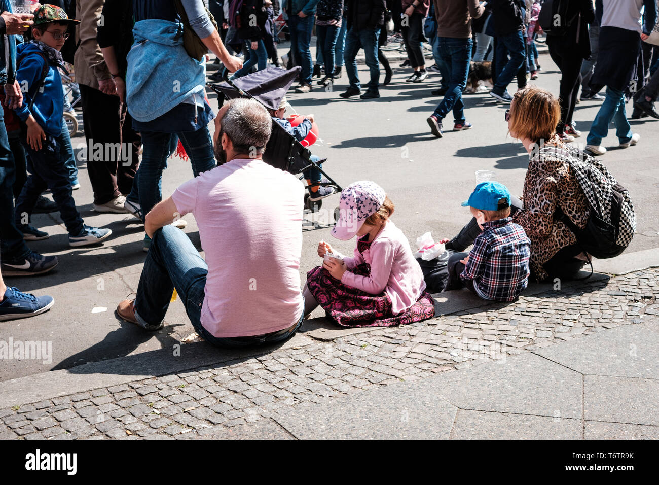 Berlin, Germany - May 01, 2019: Young family with children sitting on ...