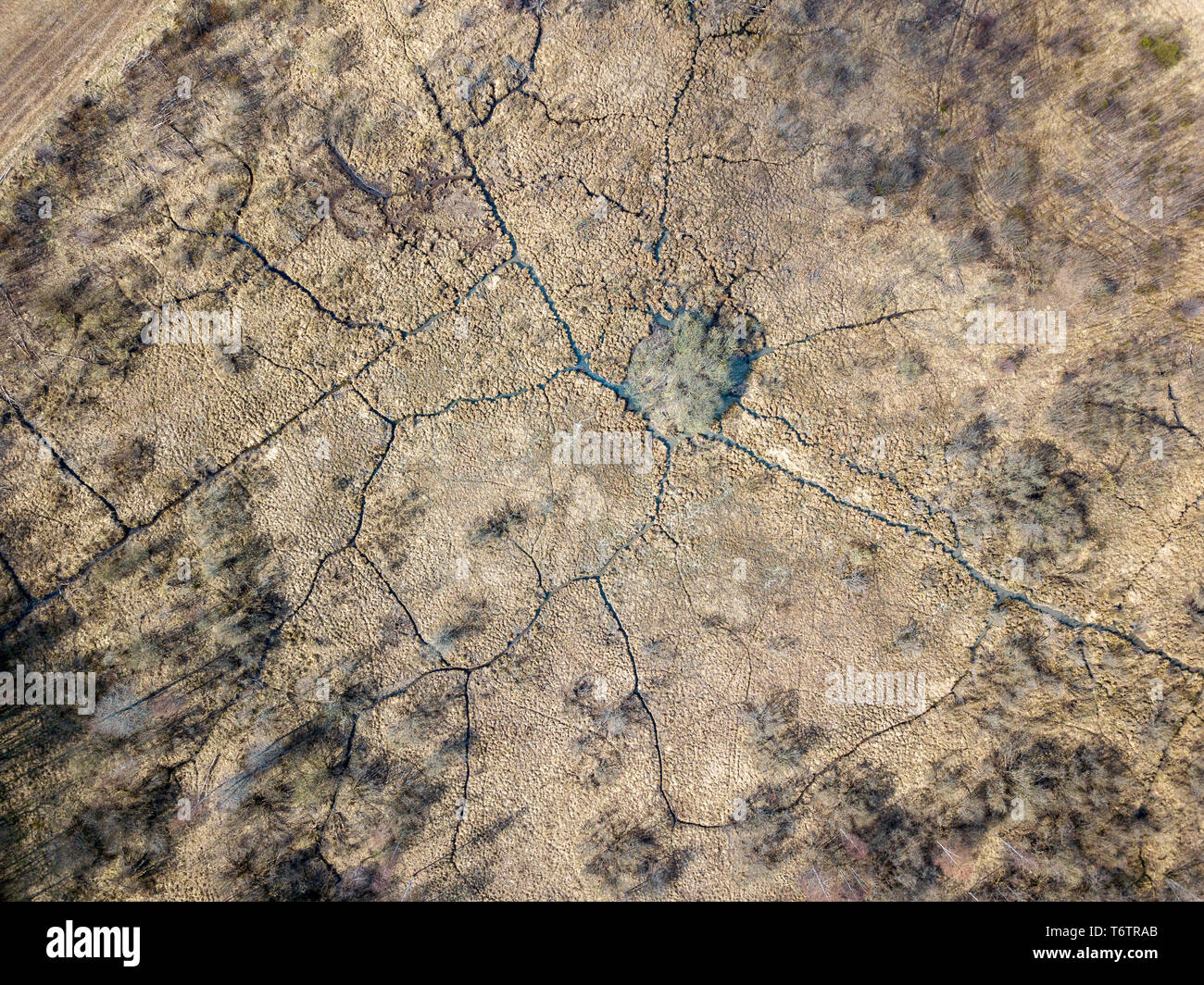 aerial view of small country river bed wavy in spring time in ...