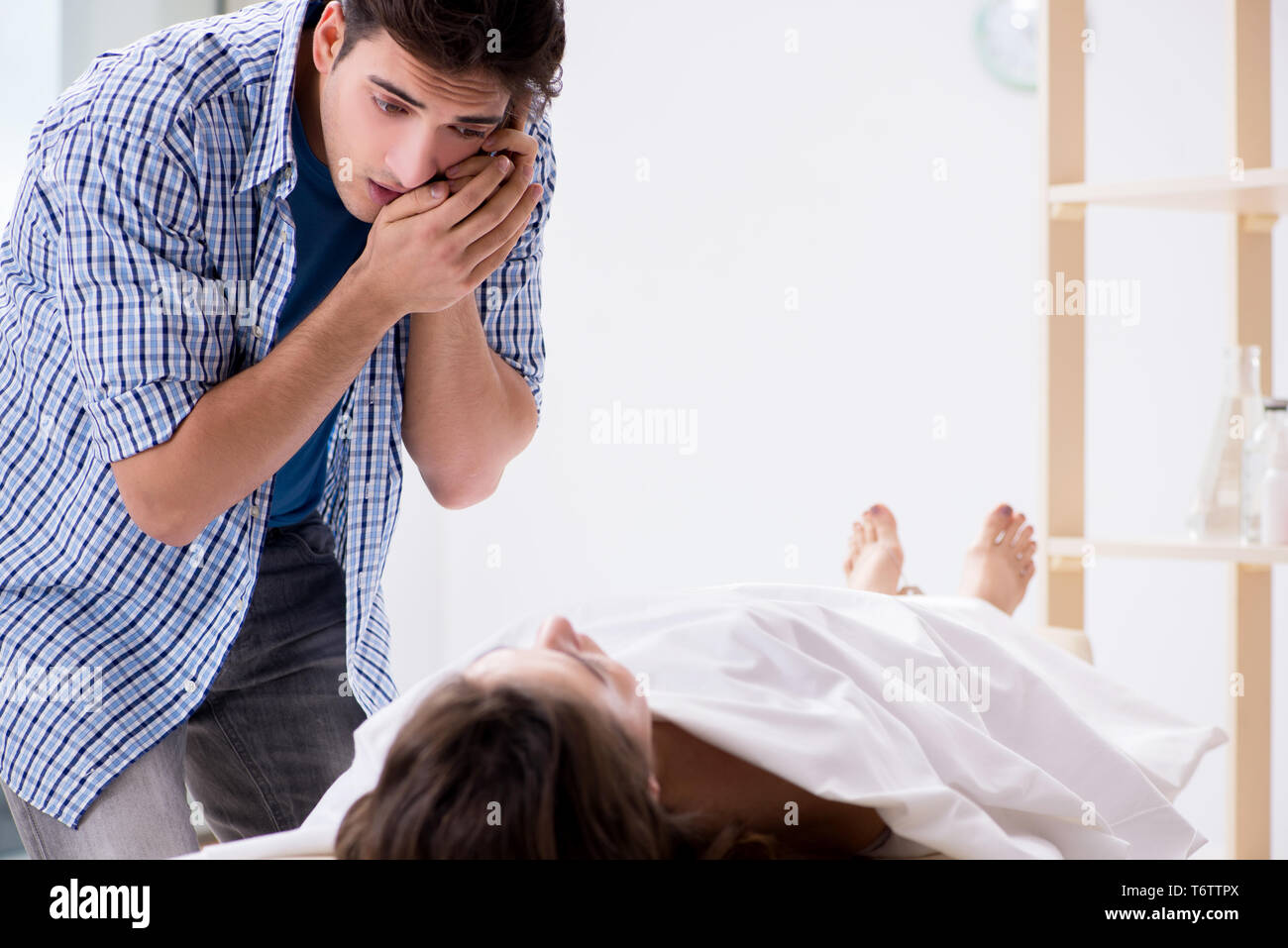 Man mourning his dead wife Stock Photo - Alamy