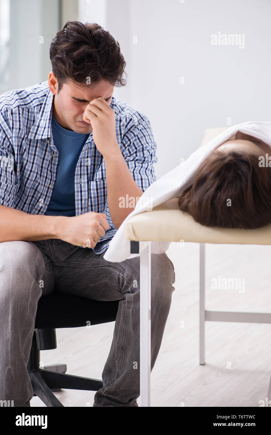 Man mourning his dead wife Stock Photo - Alamy