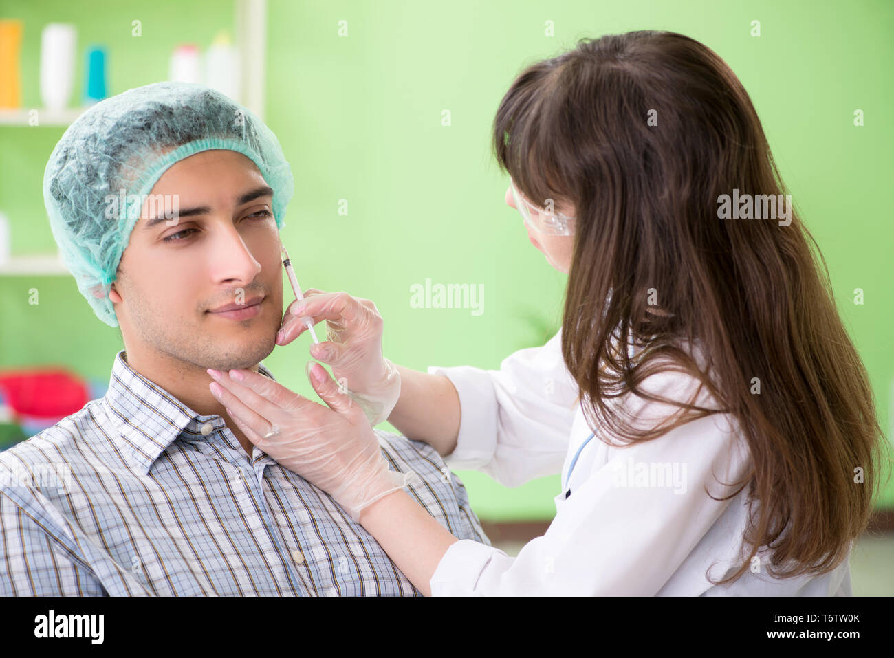 Plastic surgeon preparing for operation on man face Stock Photo - Alamy