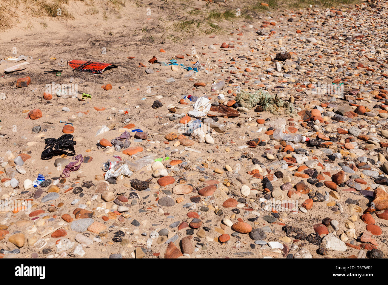 Several items of plastic bottles etc. discarded or washed up on the ...