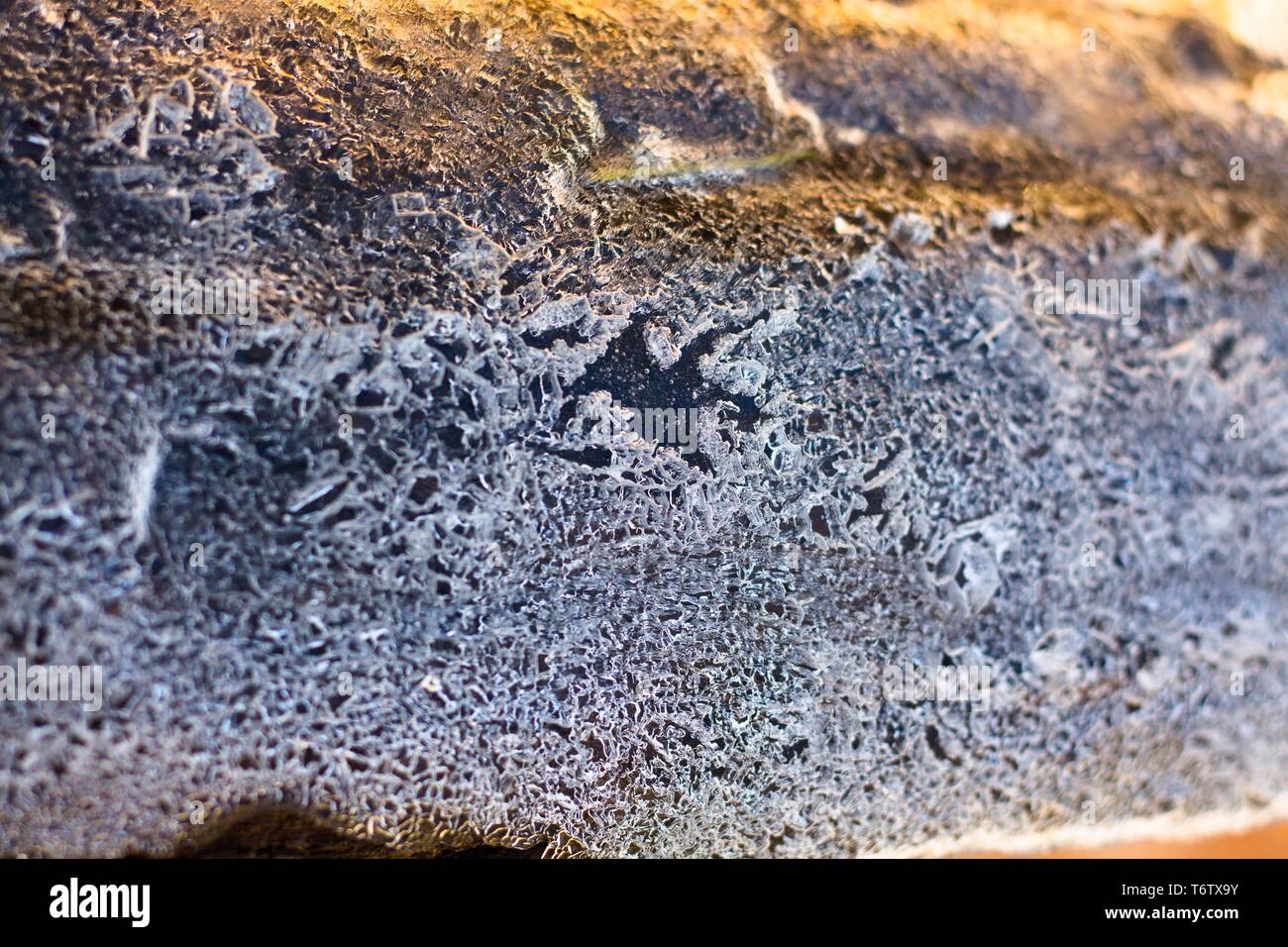 The wooden surface is covered with a thick layer of ice. The ice began ...