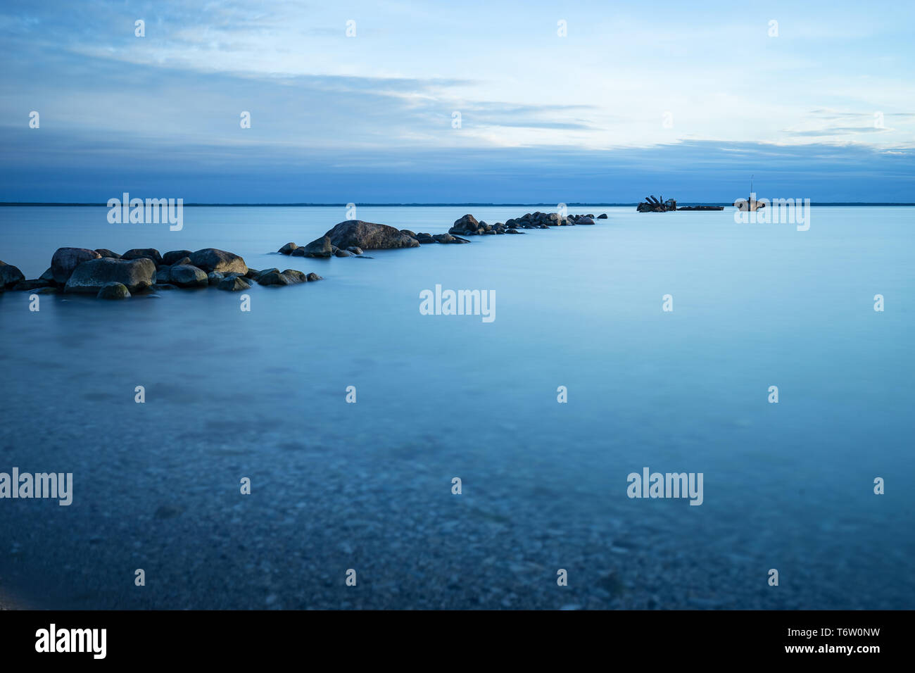 Calm blue see and big stones on the beachbeach Stock Photo - Alamy